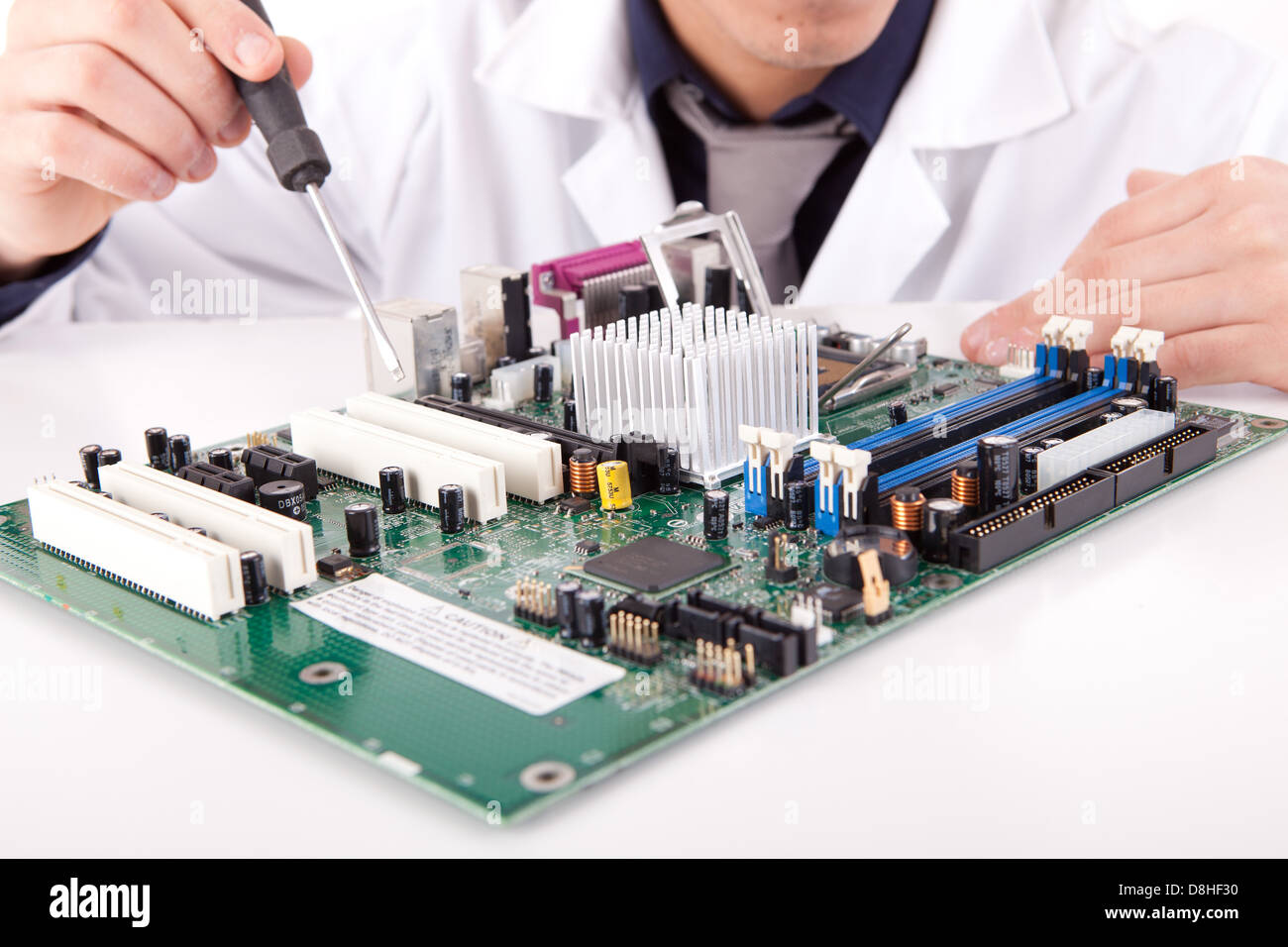 Computer engineer working on an old motherboard Stock Photo - Alamy