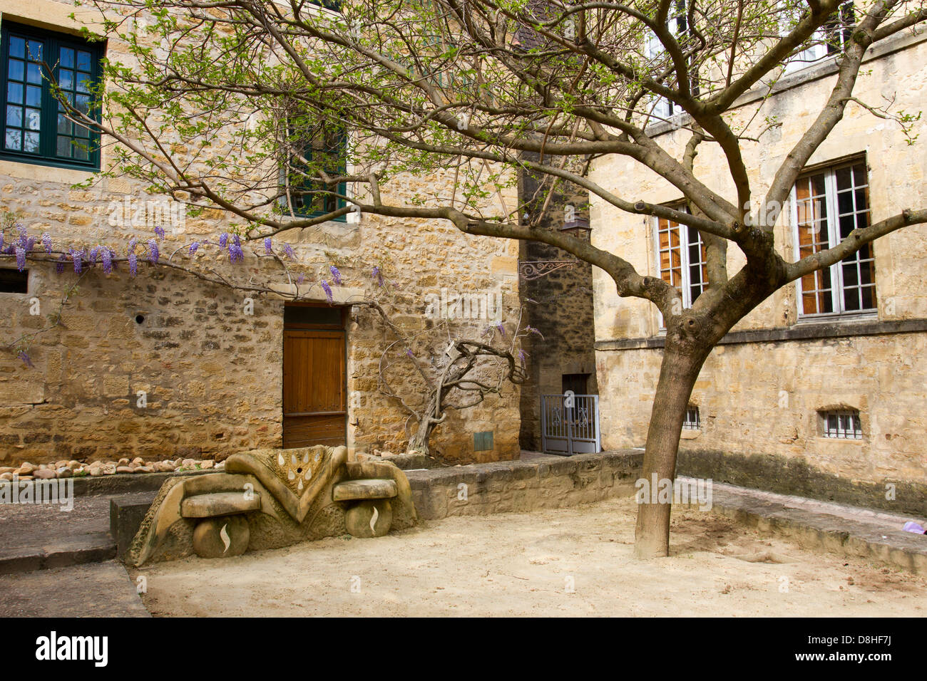 Charming courtyard with interesting stone bench among medieval ...