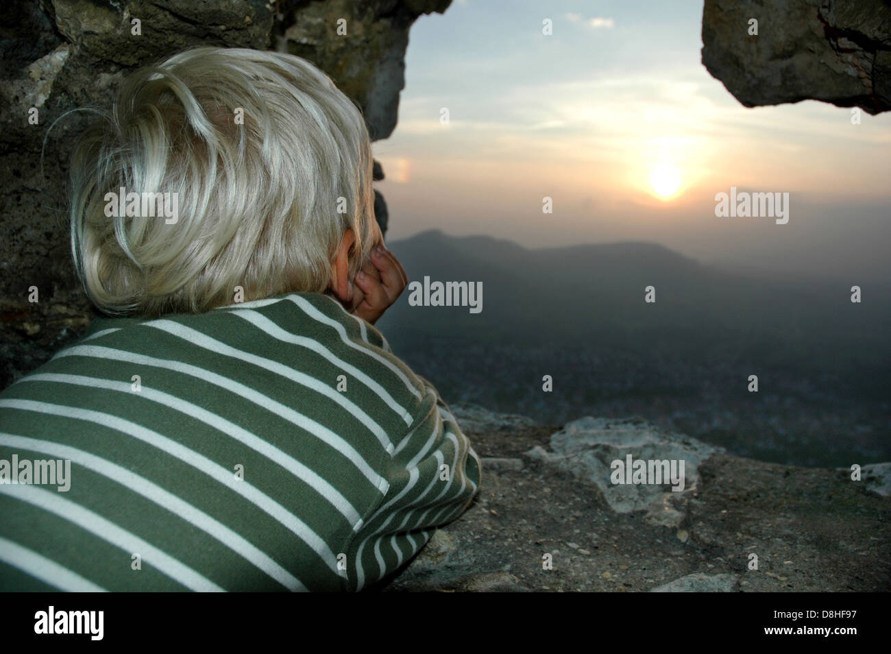 boy observes sunset Stock Photo - Alamy