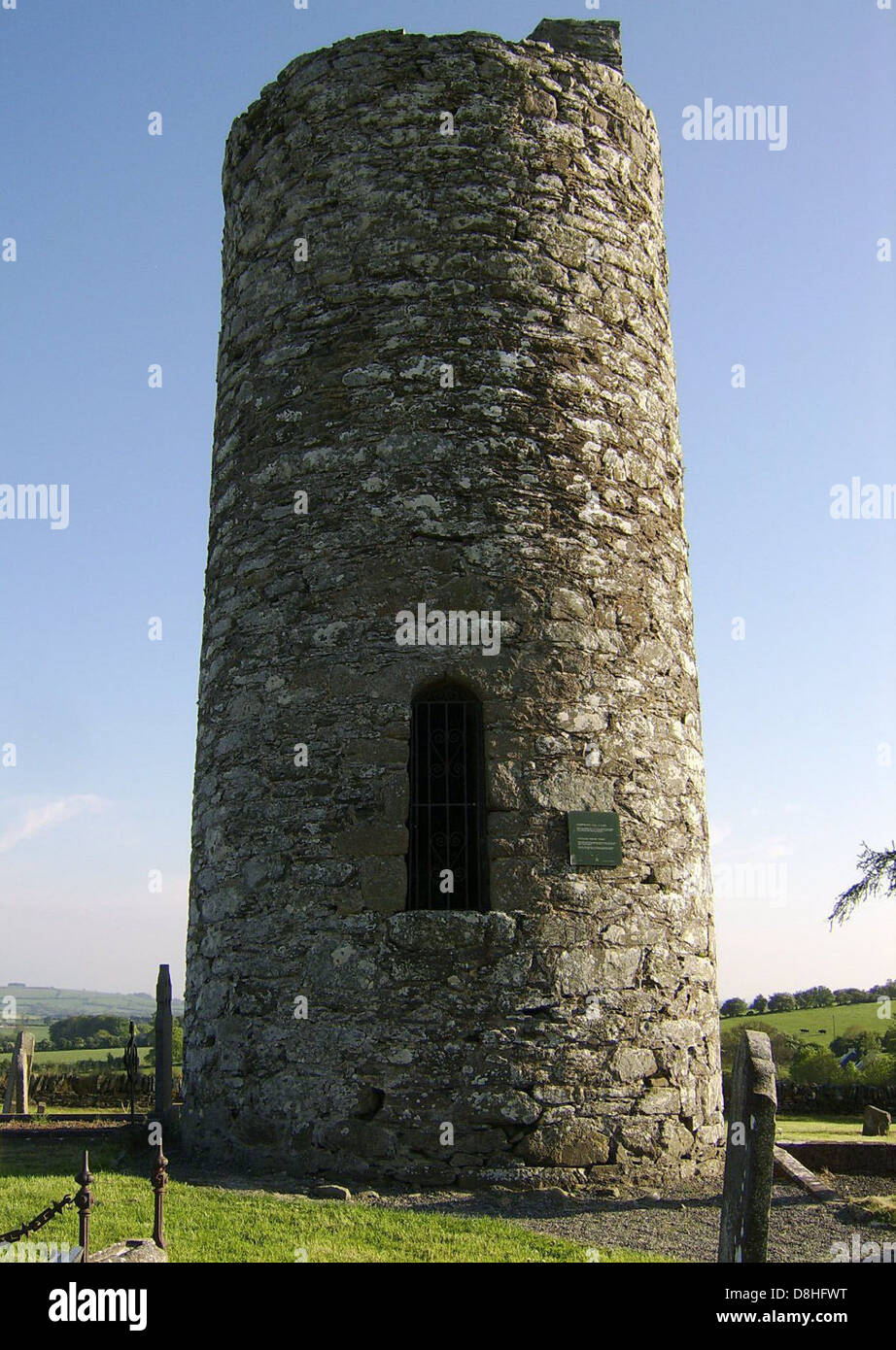 A historic view of the door side of an Irish round tower at Old ...