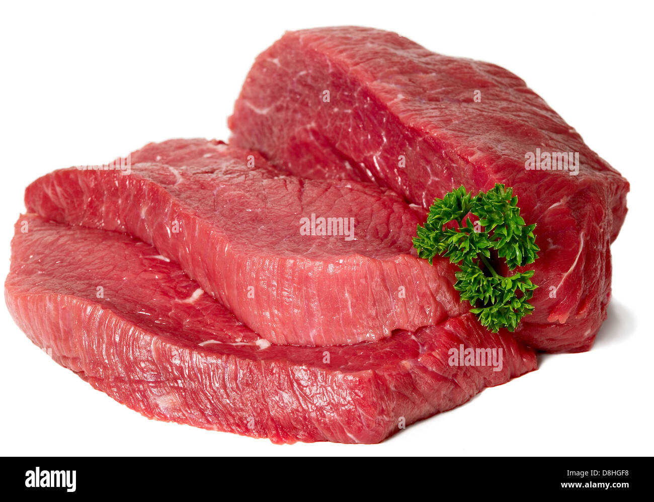 Raw sliced meat with green parsley, isolated Stock Photo - Alamy
