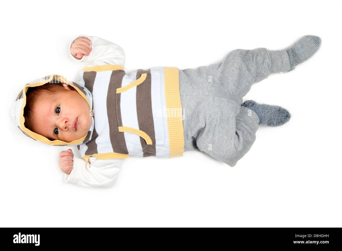 Beautiful white baby boy with big eyes is lying on white background ...