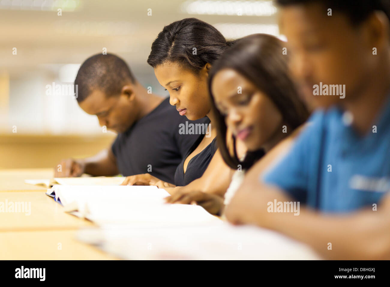 Cute african boy reading hi-res stock photography and images - Alamy