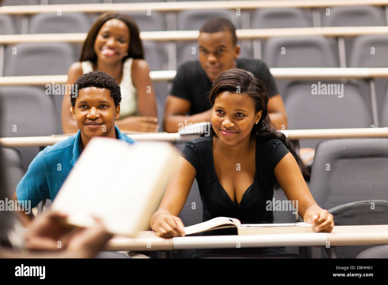 college professor lecturing group of african students in classroom ...