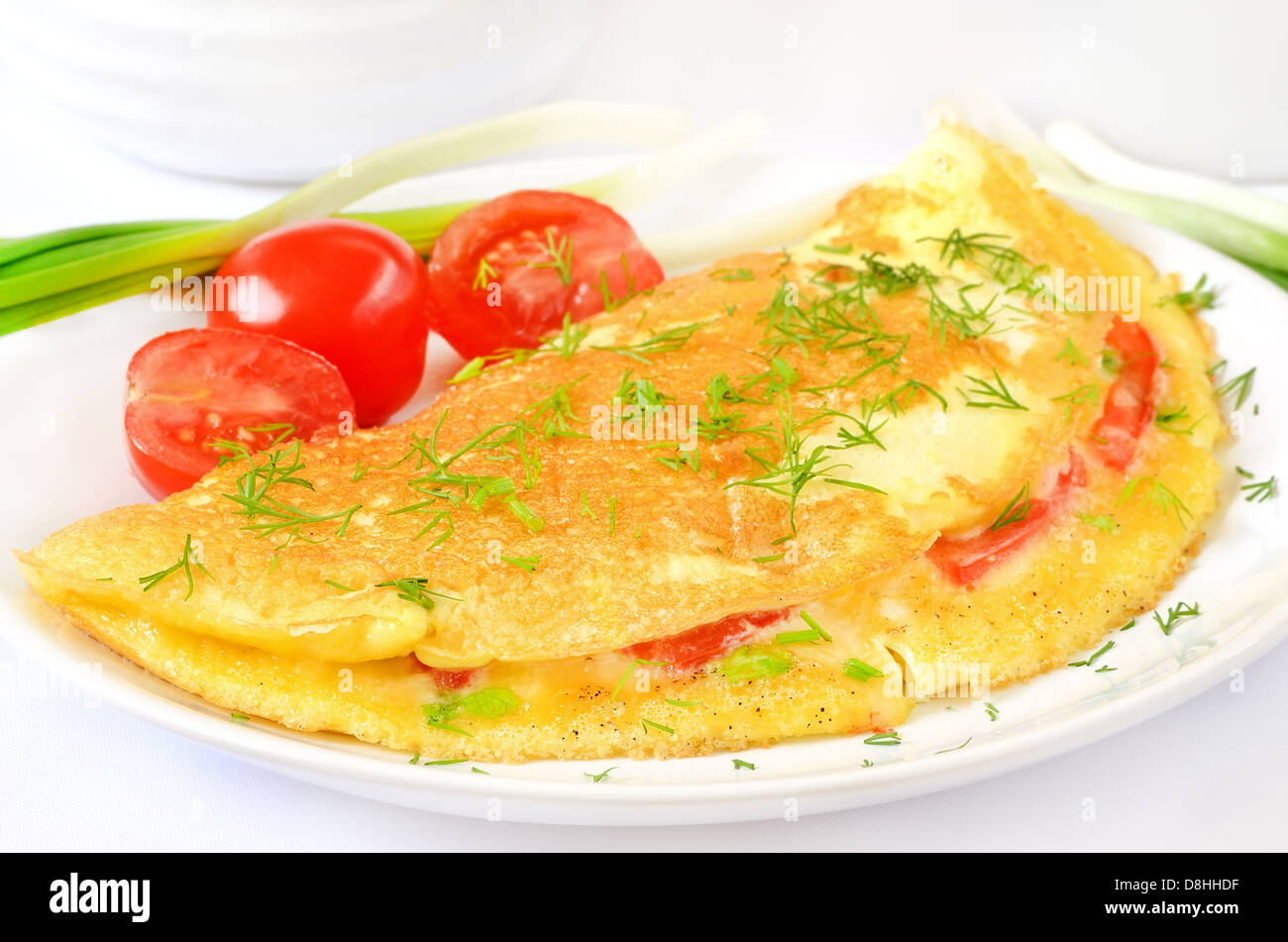 Omelet with herbs and vegetables, close up view Stock Photo - Alamy