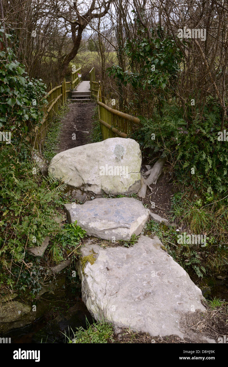 Large natural stone slabs forming a small bridge, steps and stile on a ...