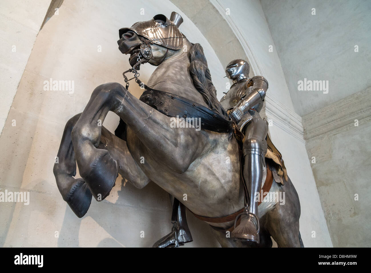 Paris, France. An armor of a medieval knight on a statue of a horse in ...