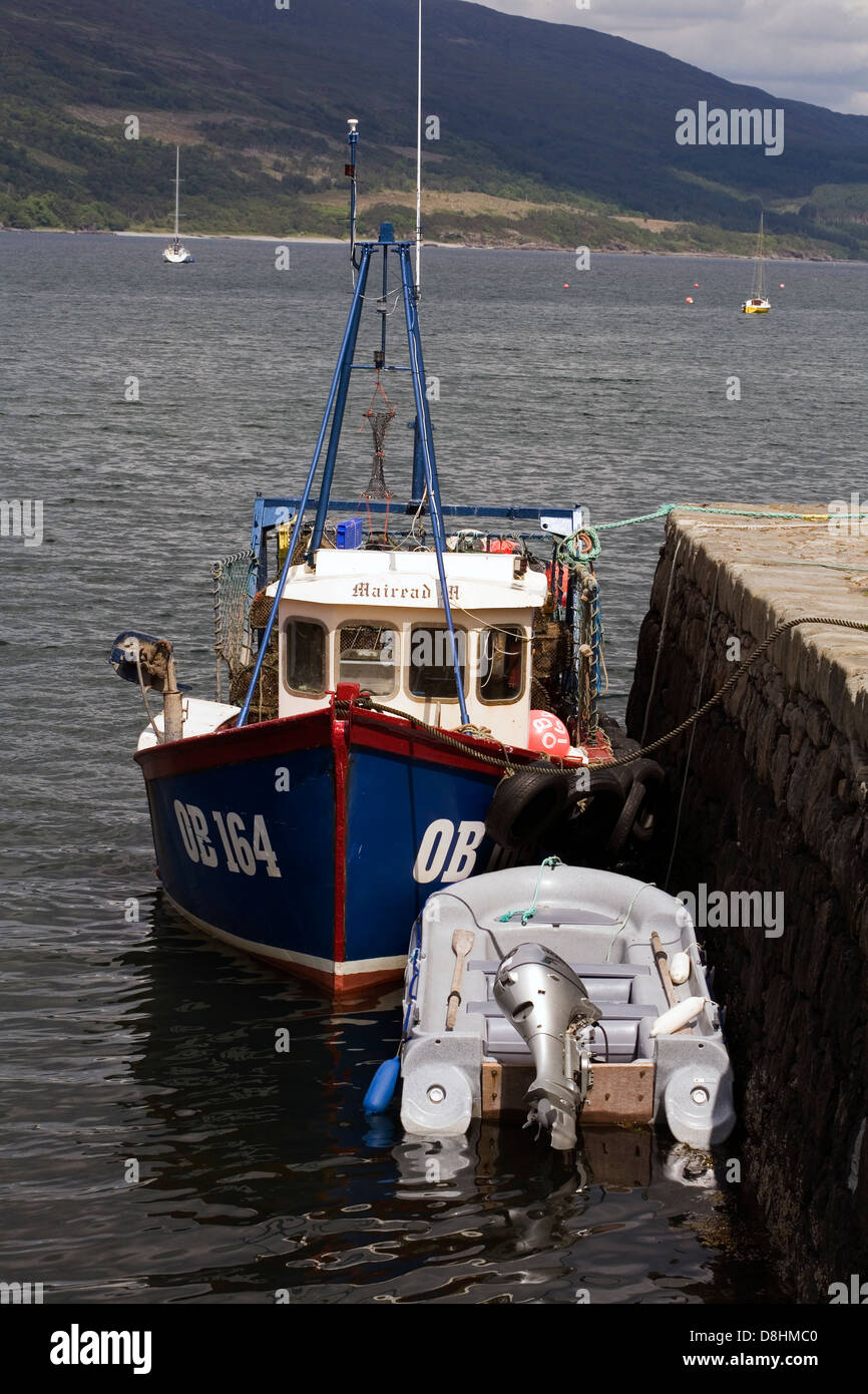 Fishing boat moored by the quayside at Eilean Iarmain or Isleornsay ...