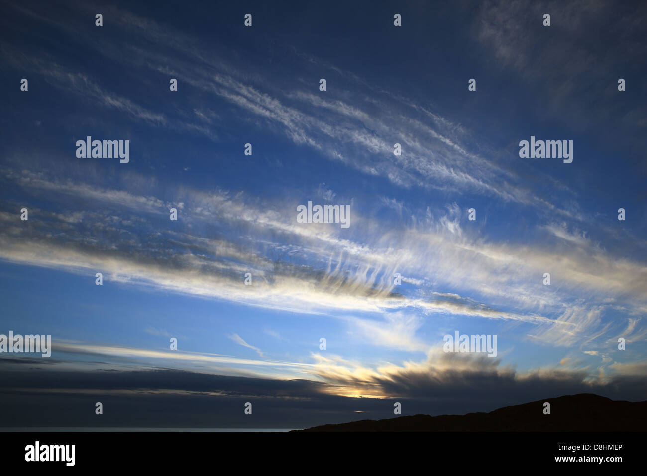 Cirrostratus high altitude clouds at evening sunset Stock Photo - Alamy