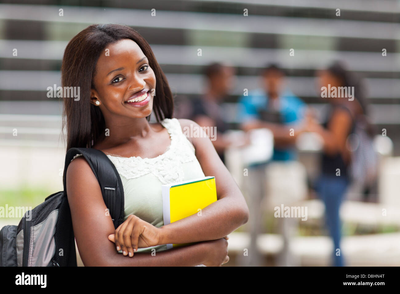 beautiful young female african college student on campus Stock Photo ...