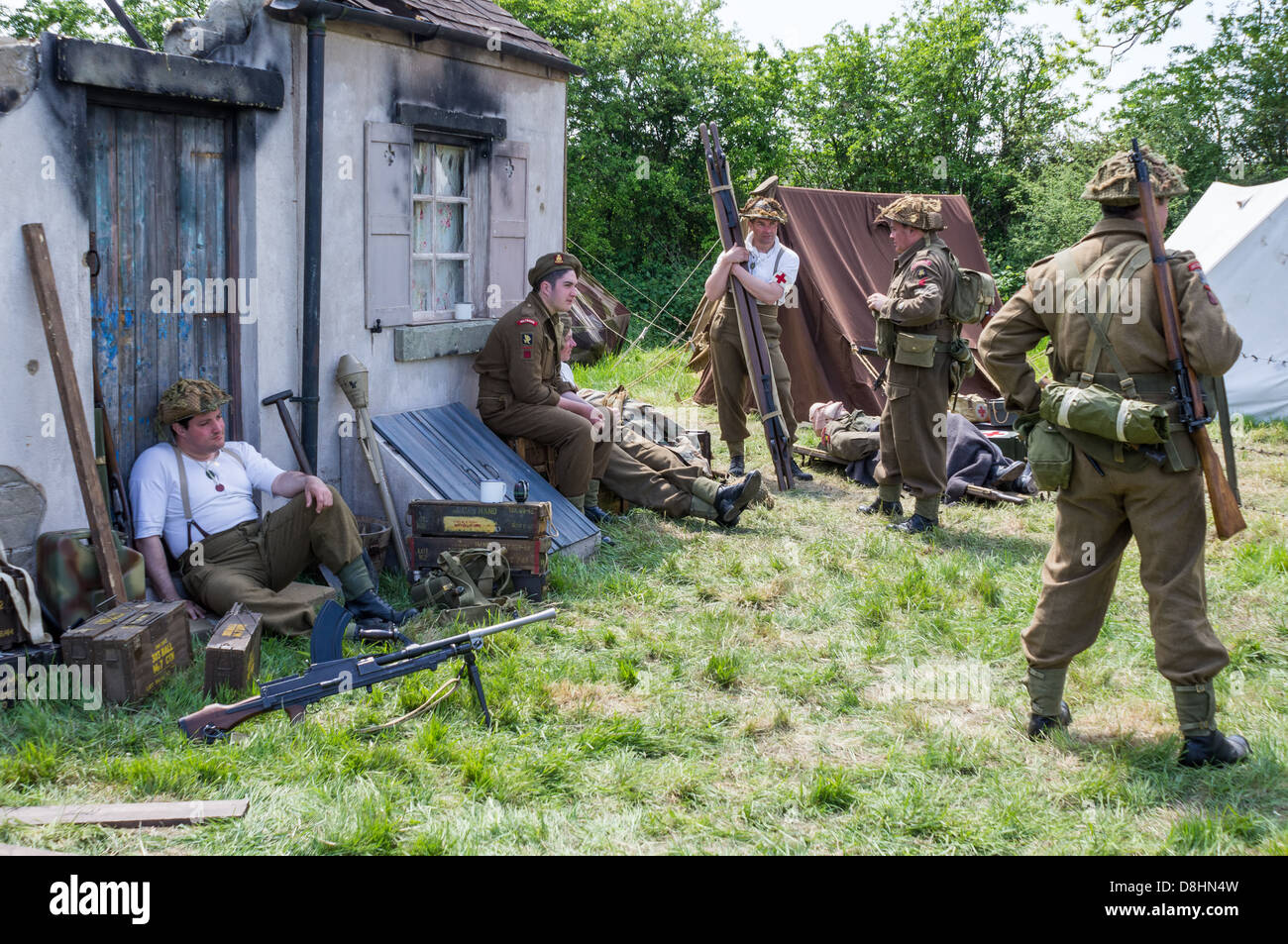 British soldiers relaxing amongst ruined buildings during the Overlord ...