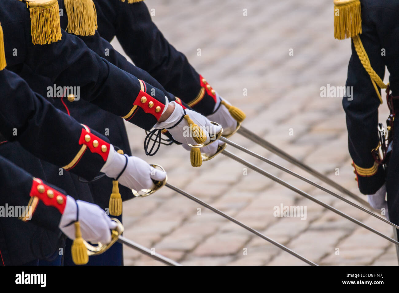 Les Invalides, Paris, France. French officer cadets raise their sword ...