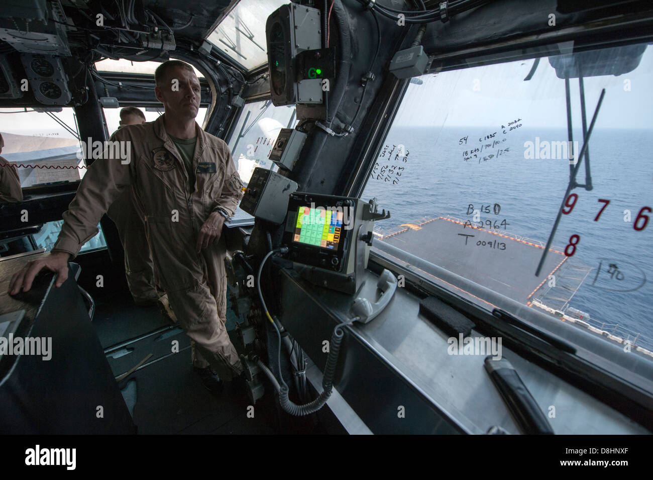 Marine observes flight operations at sea Stock Photo - Alamy