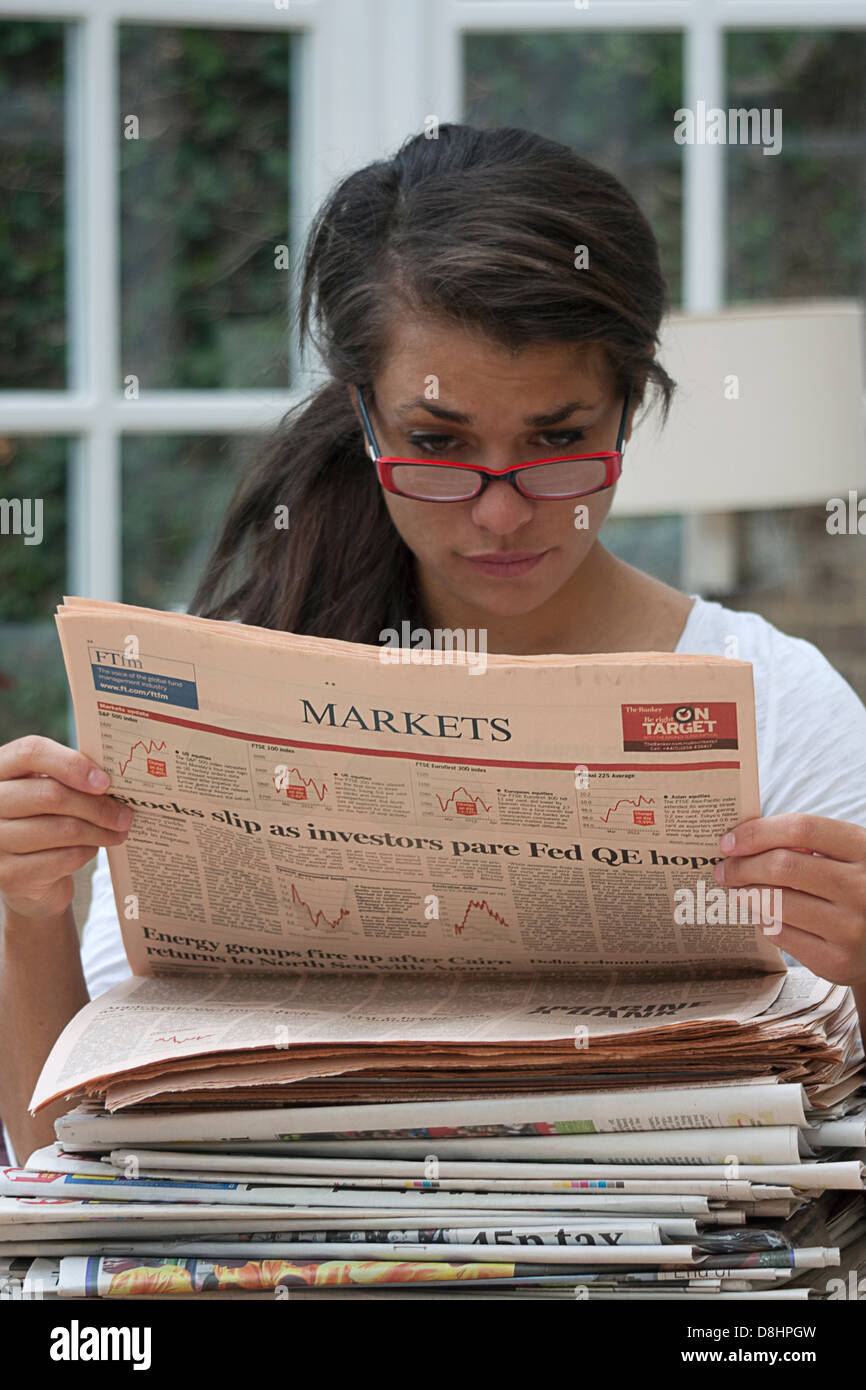 young woman reading financial times Stock Photo - Alamy
