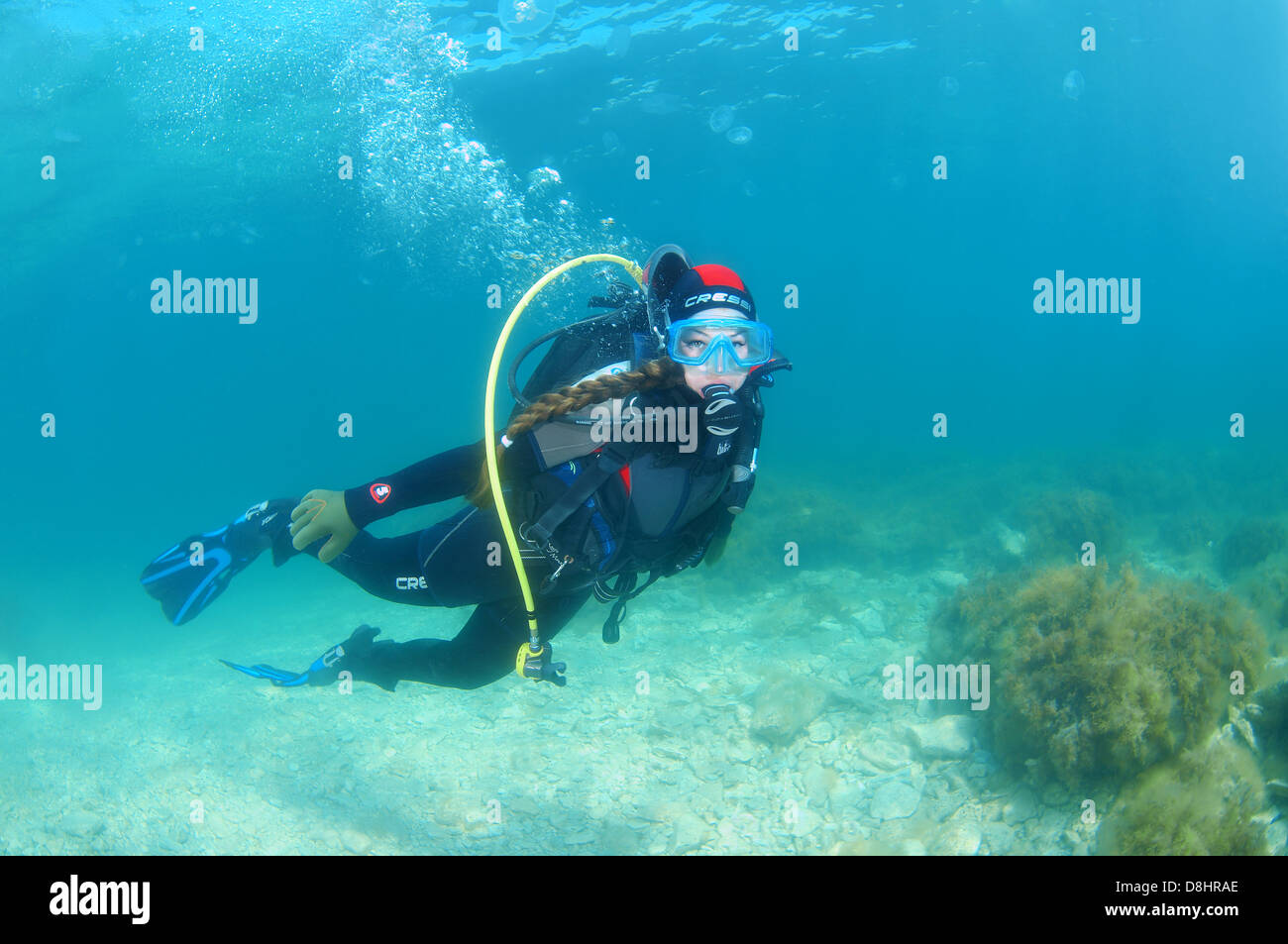 young woman scubadiver swim in the buue water. Black Sea, Crimea ...