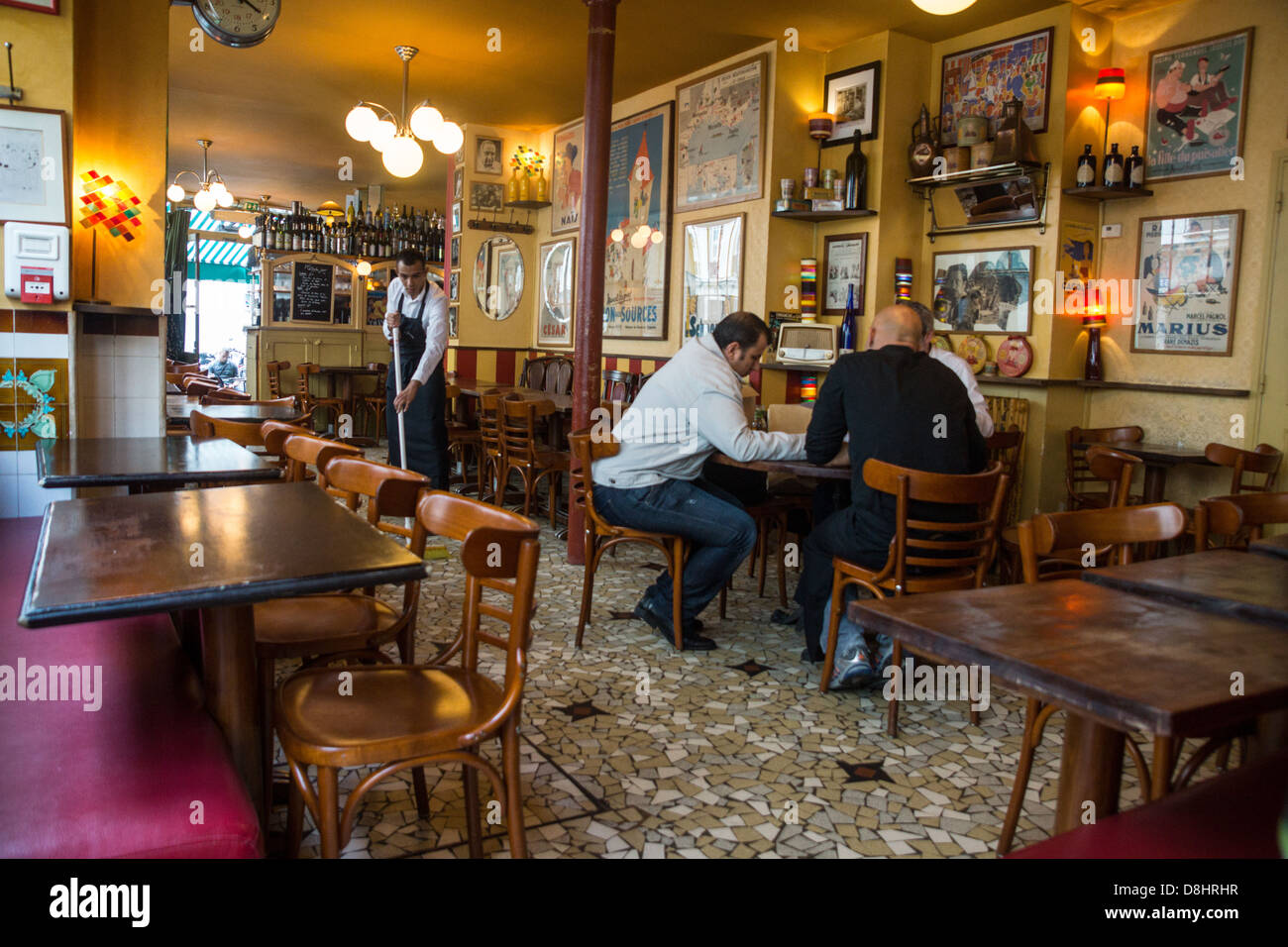 Paris, France. Men in an almost empty restaurant in the Marais quarter ...