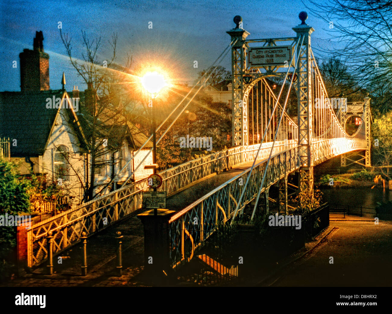 Suspension Queens Park footbridge river Dee Chester City at dusk, North ...