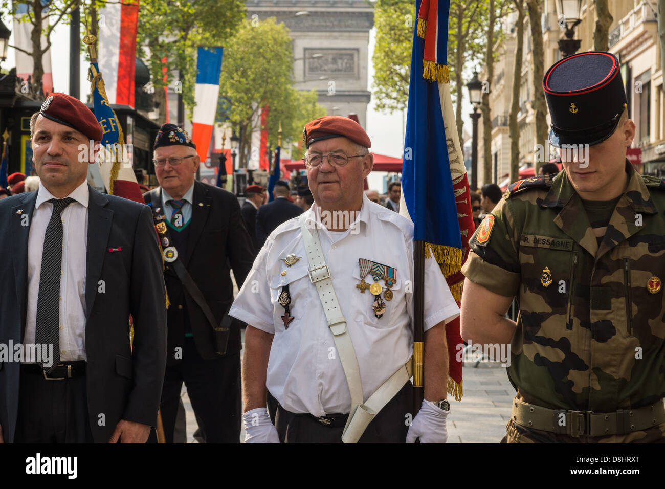 Polish and French veterans of WWII with French soldier on Champs ...