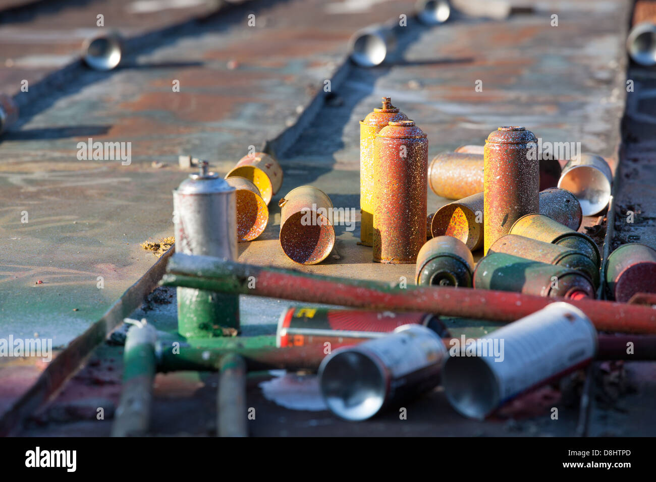 Used graffiti spray cans lay around Stock Photo - Alamy