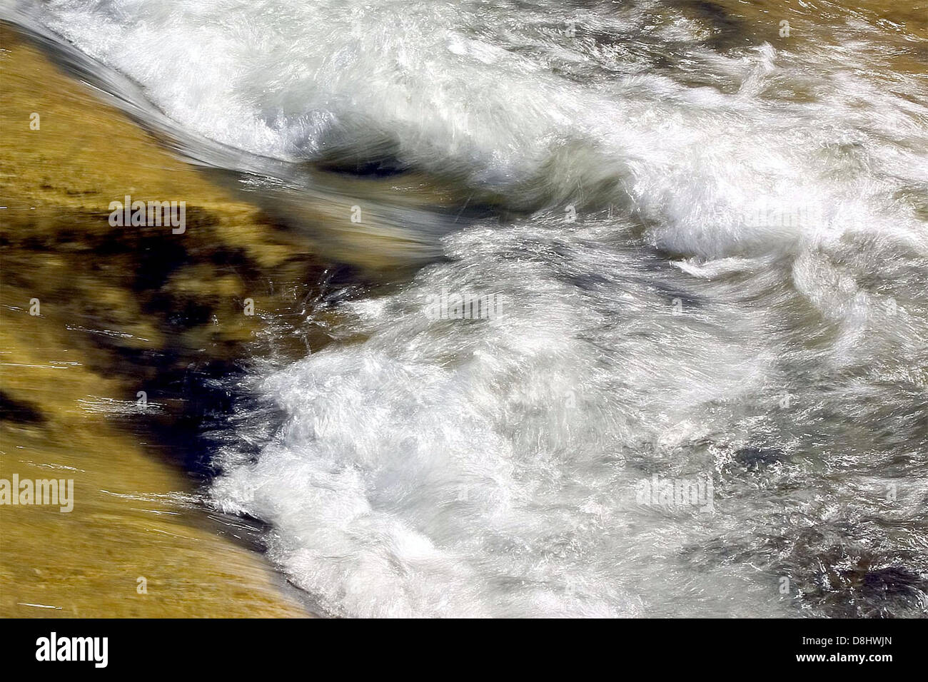 A fast-moving stream with rushing water, showcasing the power and flow ...