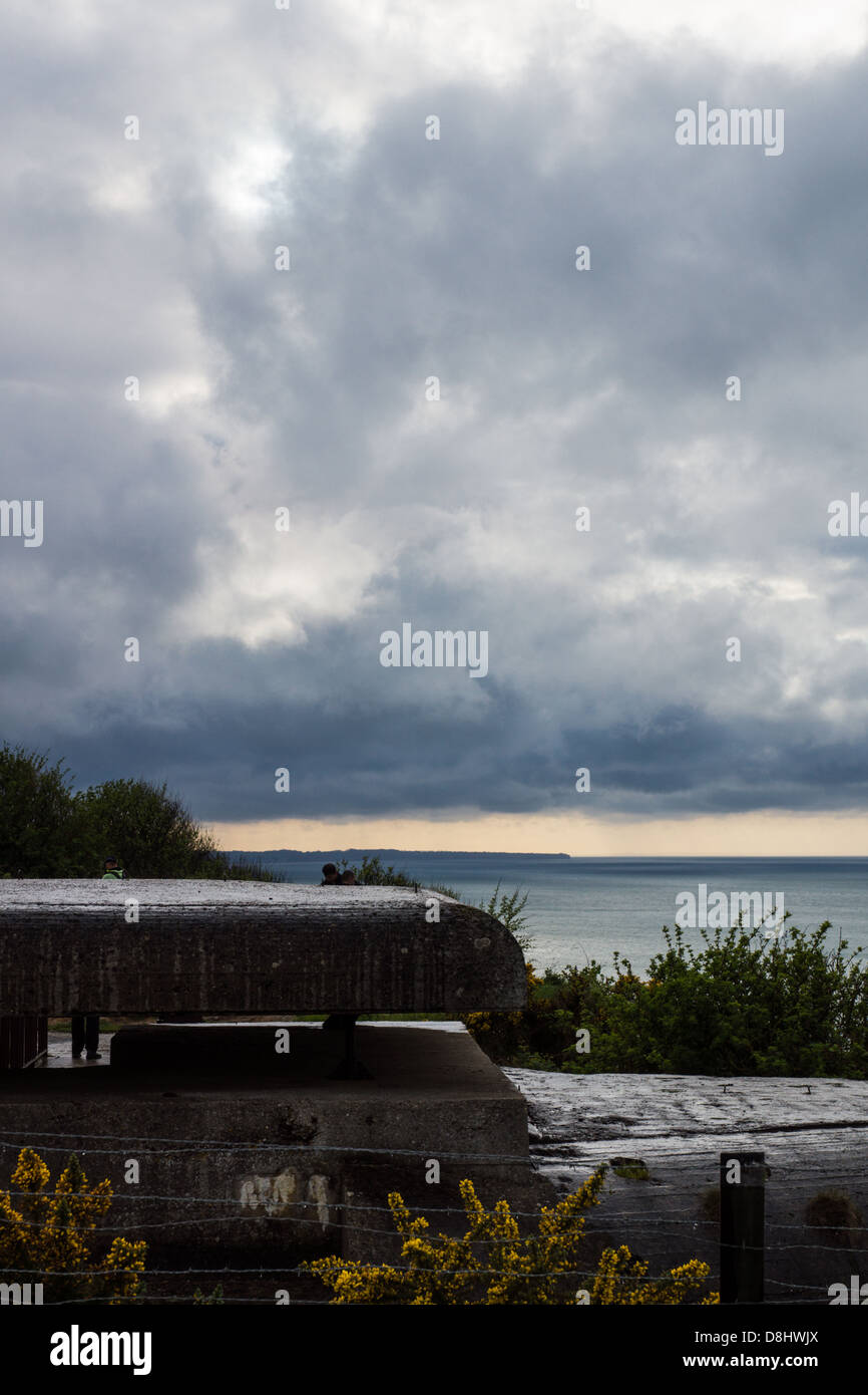 Normandy, France. Stormy skies over the fire control bunker of the WWII ...