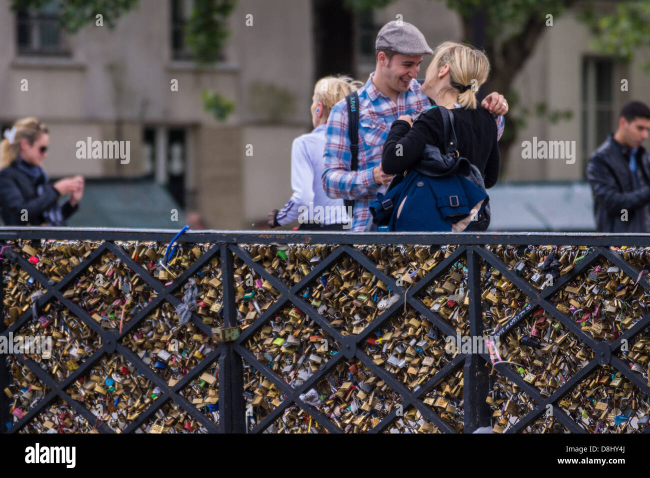 Paris, France. A Couple hugs and kisses on the Pont de l'Archevêché ...