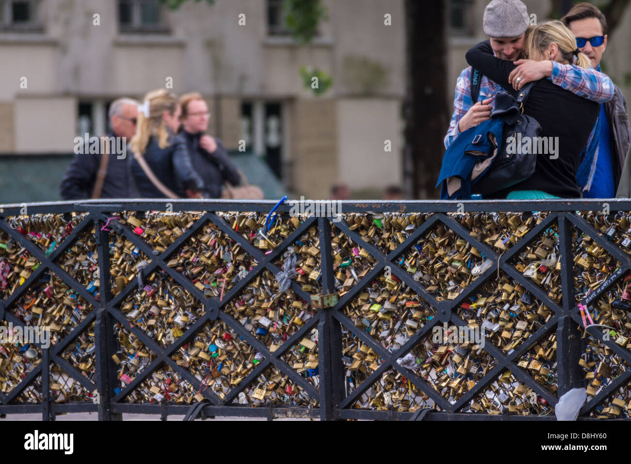 Paris, France. A Couple hugs and kisses on the Pont de l'Archevêché ...