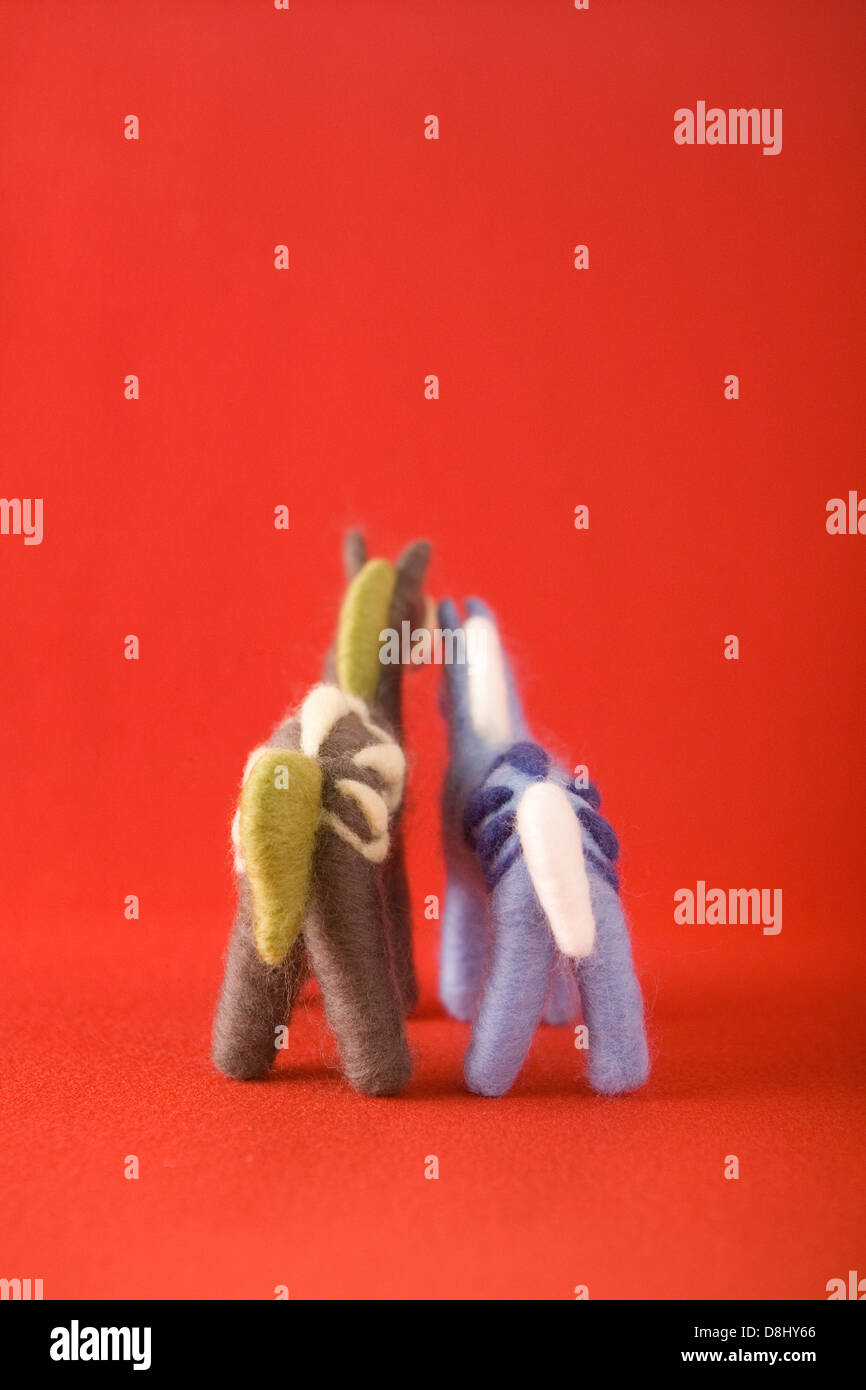 Two Felt Toy Horses on Red Paper Stock Photo - Alamy