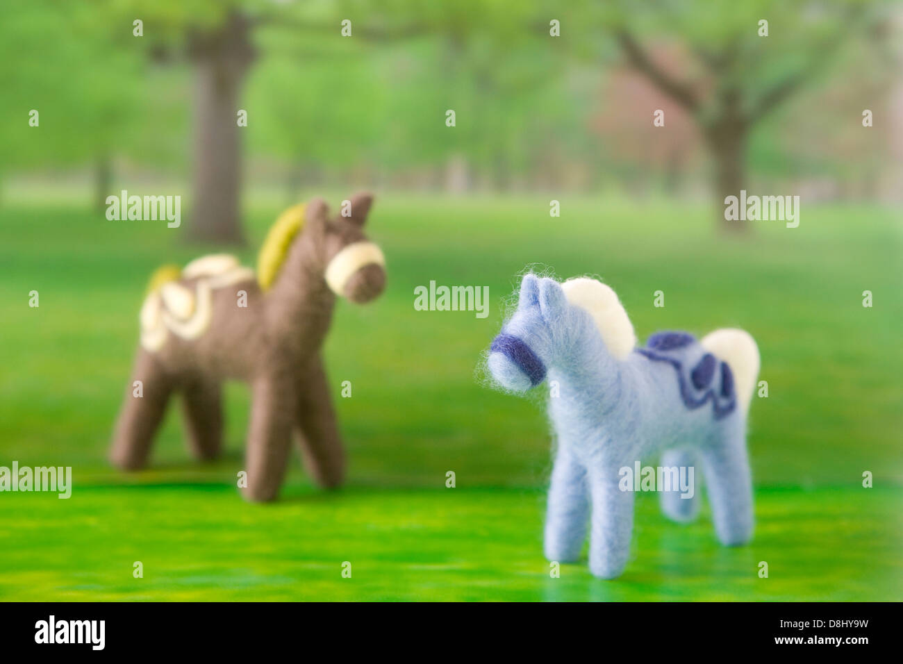Two Felt Toy Horses on Printed Background Image Stock Photo - Alamy