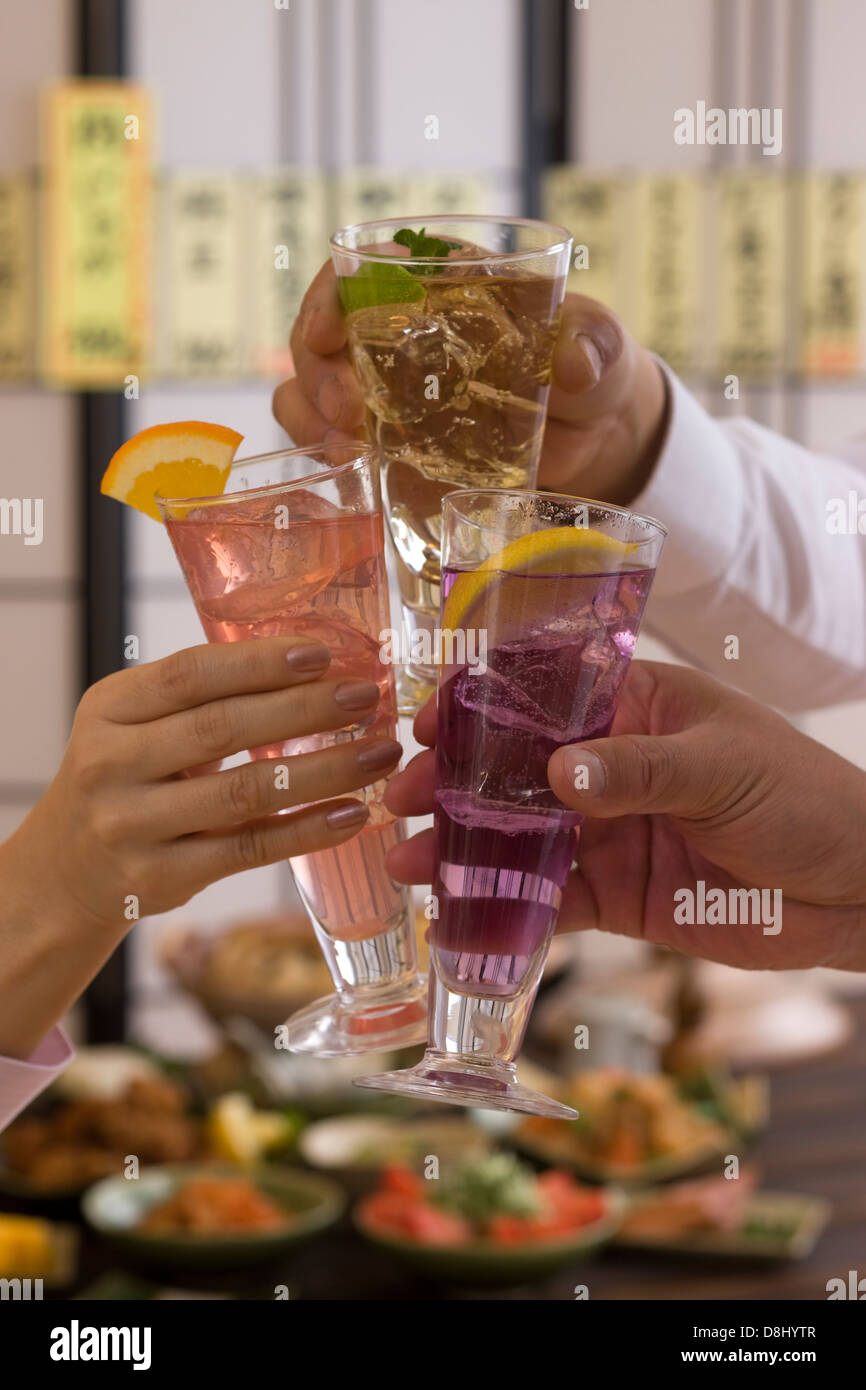 Three People Toasting with Various Cocktails at Izakaya Stock Photo - Alamy