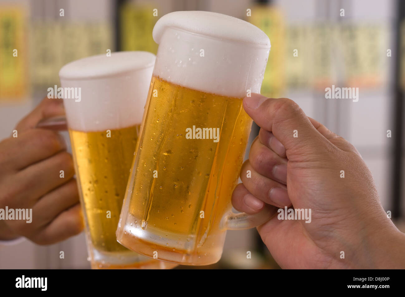Two people toasting beer izakaya hi-res stock photography and images ...