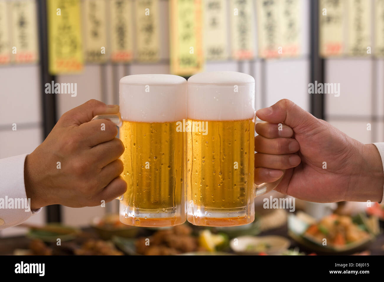 Two people toasting beer izakaya hi-res stock photography and images ...
