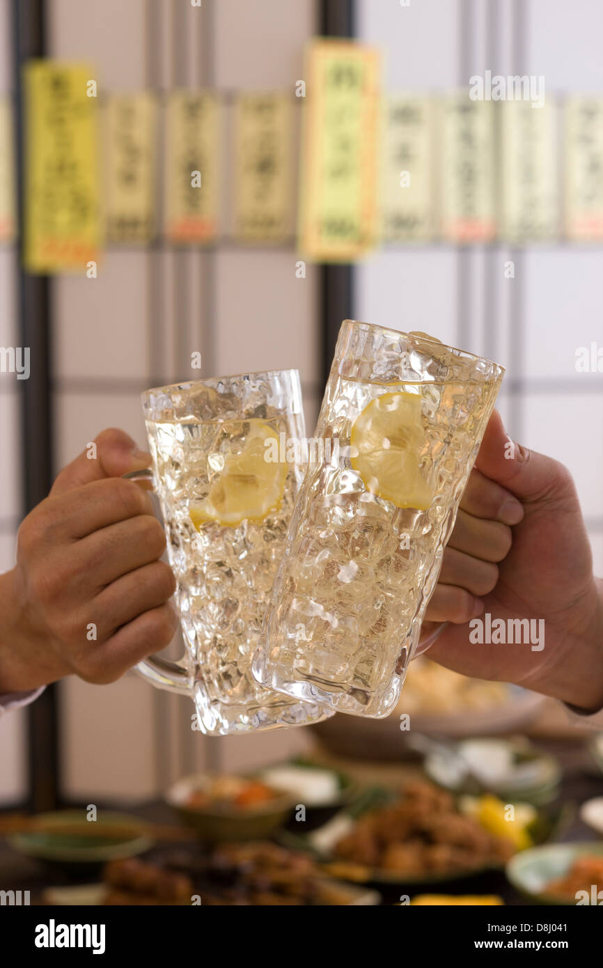 Two People Toasting with Whisky and Soda at Izakaya Stock Photo - Alamy
