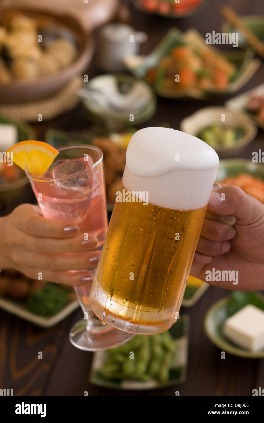 Two people toasting beer izakaya hi-res stock photography and images ...