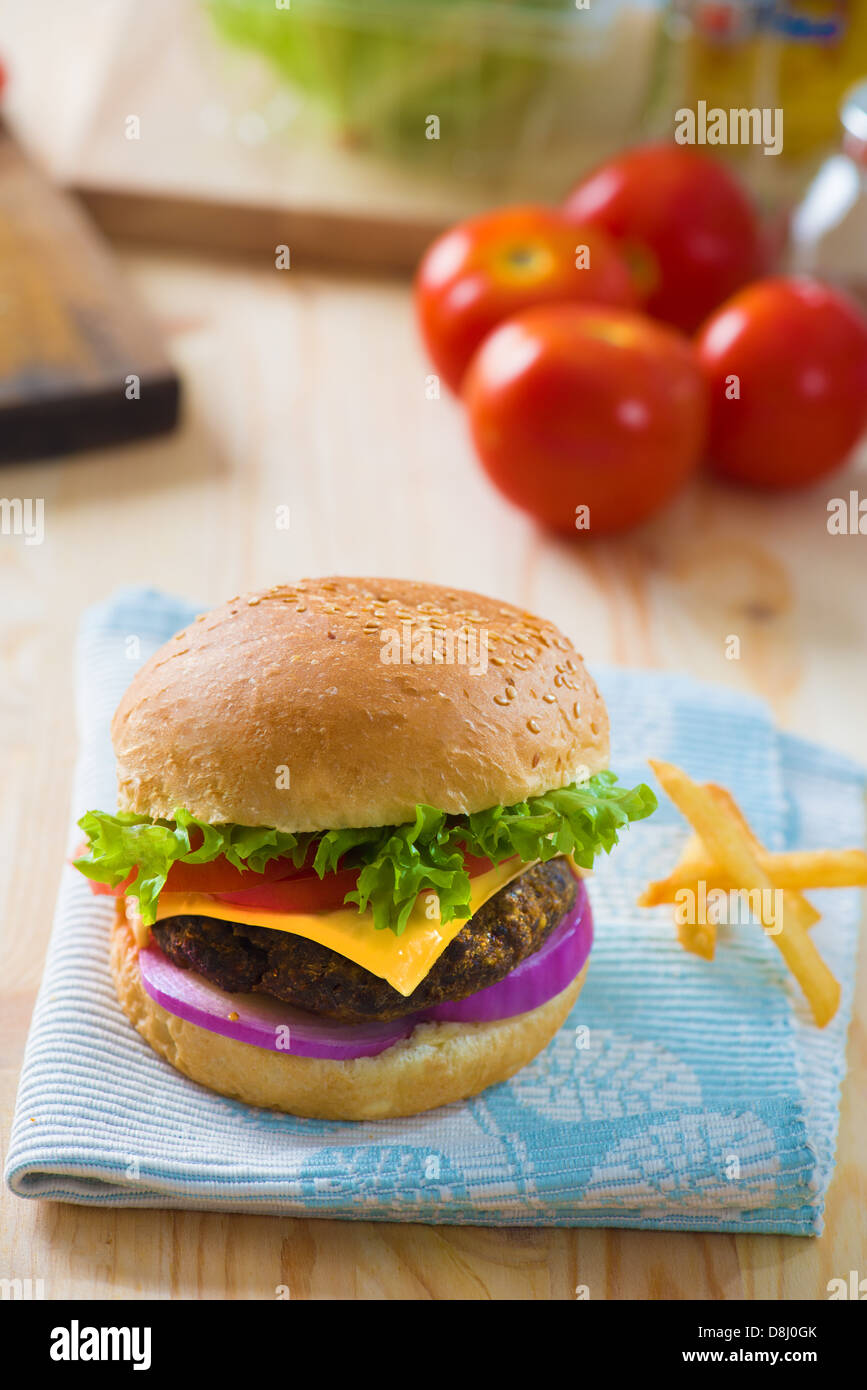 burger with fast food items and materials on the background Stock Photo ...