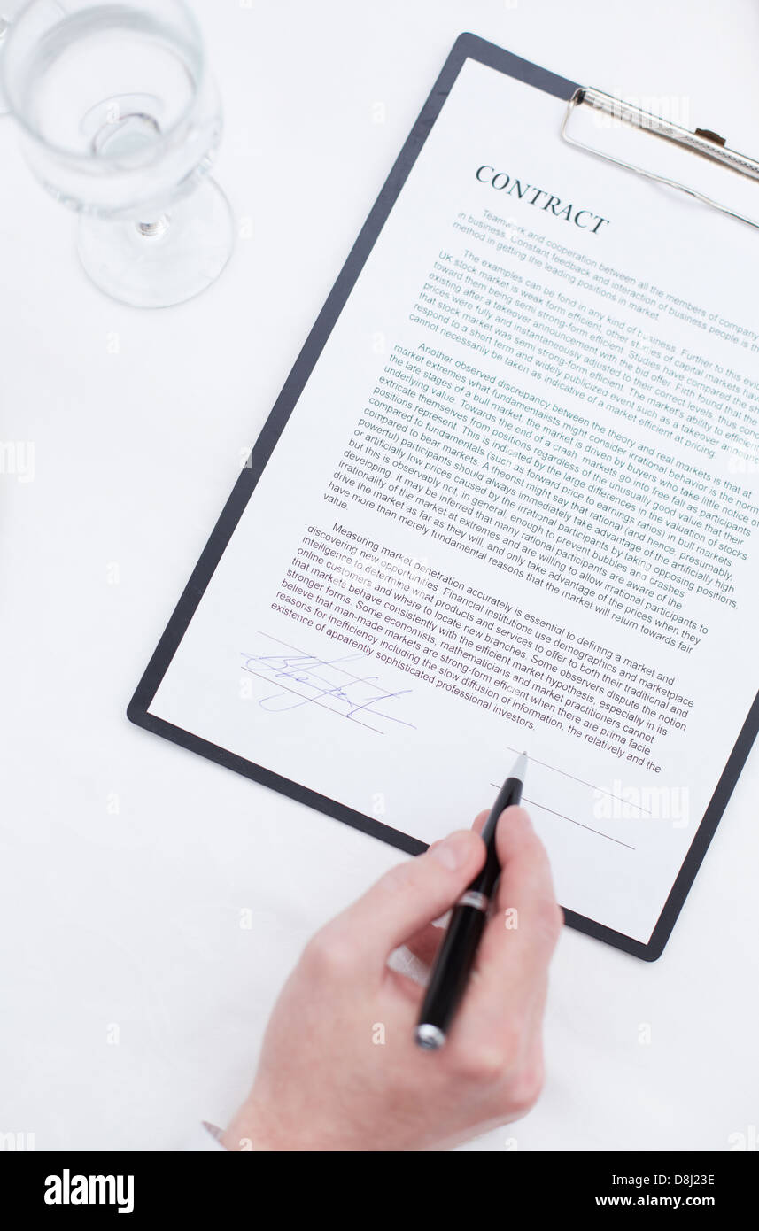 Image of businessman hand with pen signing contract Stock Photo - Alamy