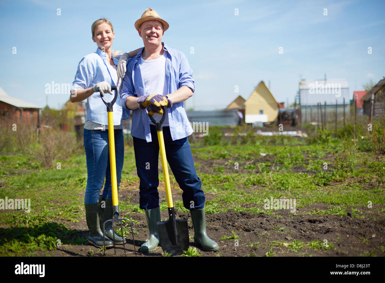 Image of two happy farmers in the garden Stock Photo - Alamy