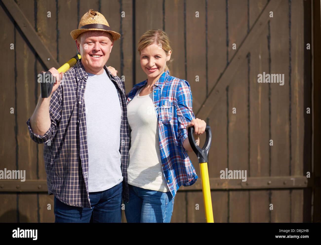 Image of two happy farmers with instruments Stock Photo - Alamy