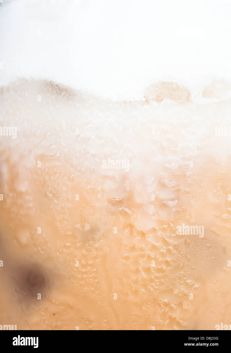 Fizzy glass of milk foam and iced espresso up close Stock Photo - Alamy