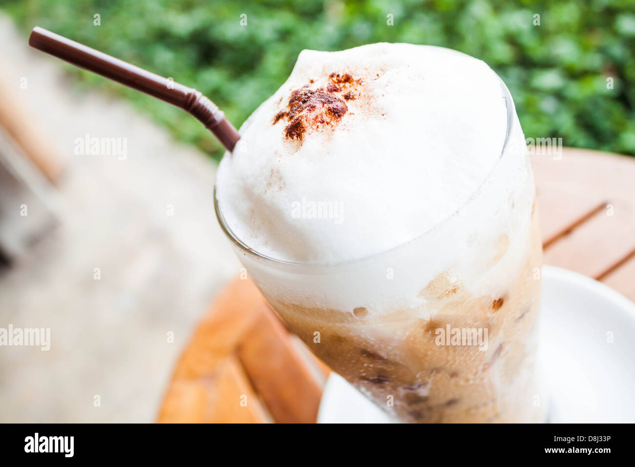 Refreshing glass of iced blended frappucino with milk foam Stock Photo ...