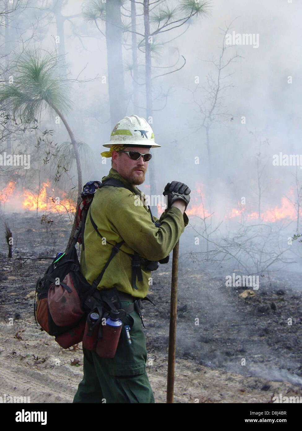 This stock photo shows a fireman equipped with firefighting gear ...