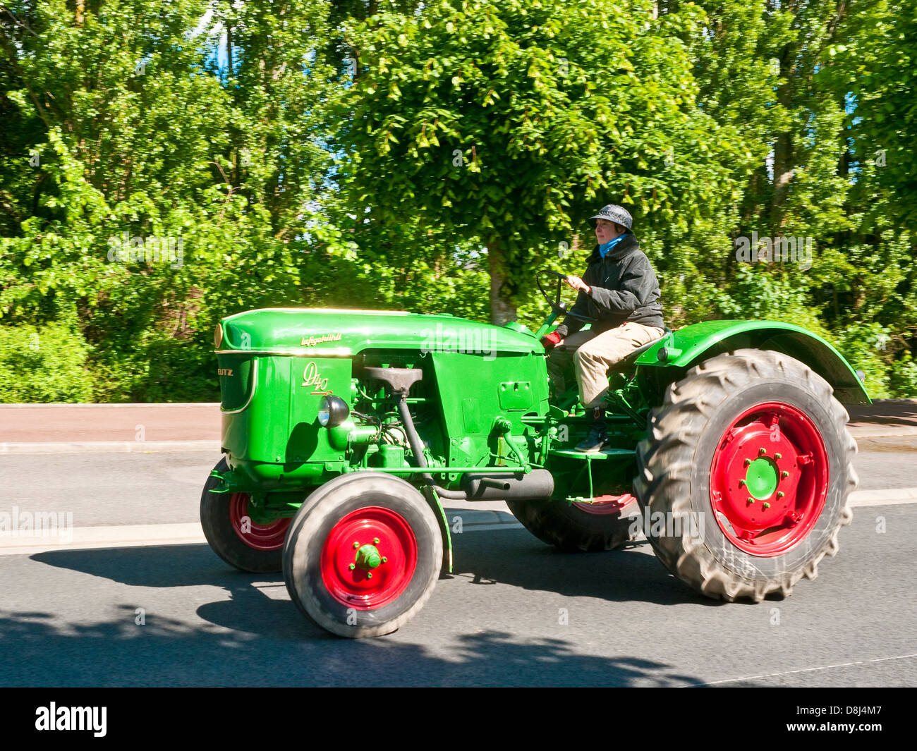 French farmer driving old restored Deutz D40 tractor on "Retro ...