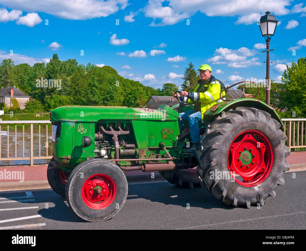 French farmer driving old restored Deutz-Fahr D55 tractor on "Retro ...