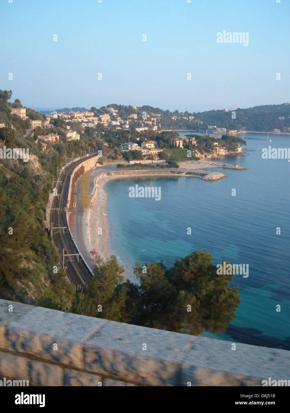A view of a sandy beach along the French coast, with gentle waves ...