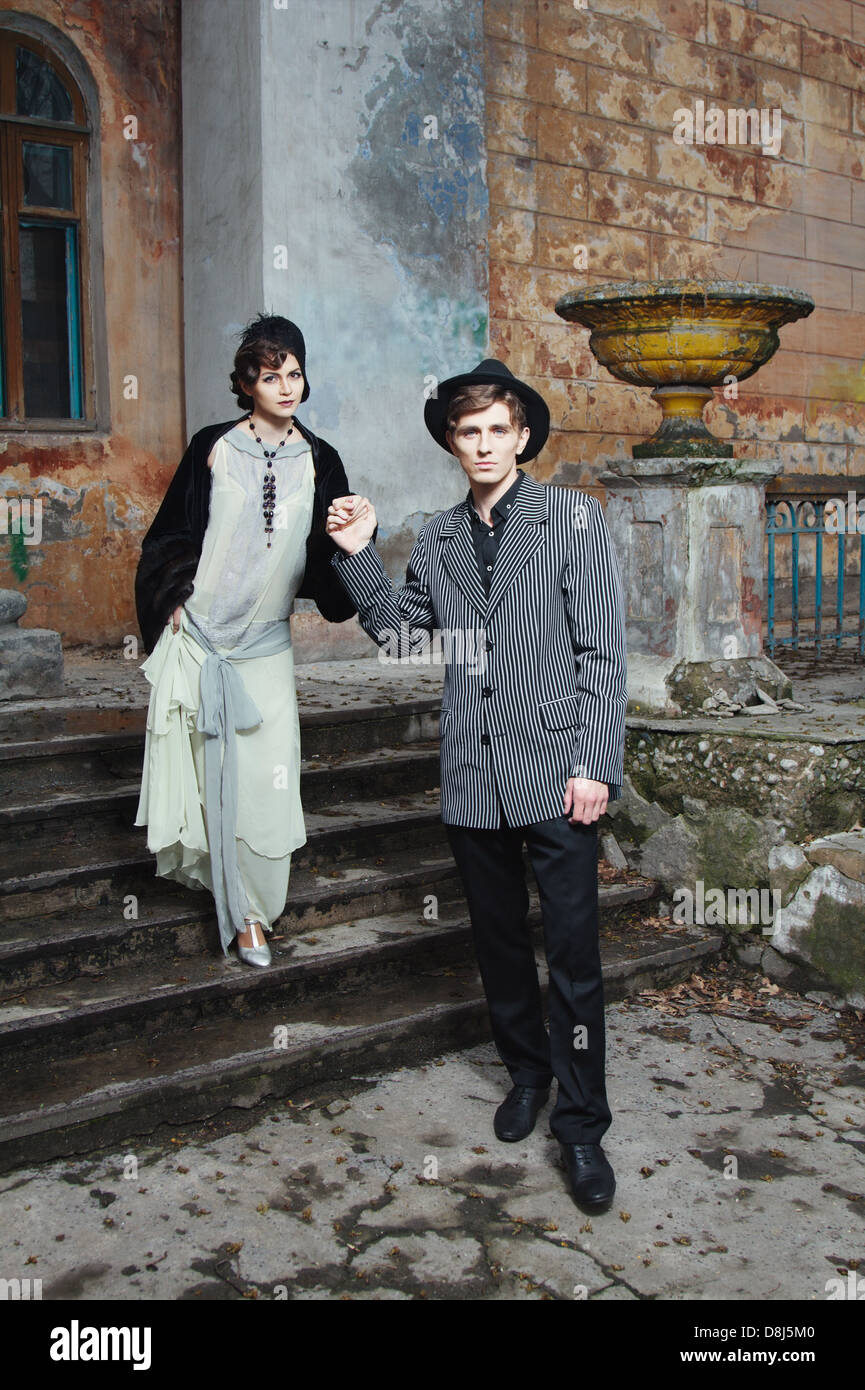 Retro styled fashion portrait of a young couple. Clothing and make-up ...