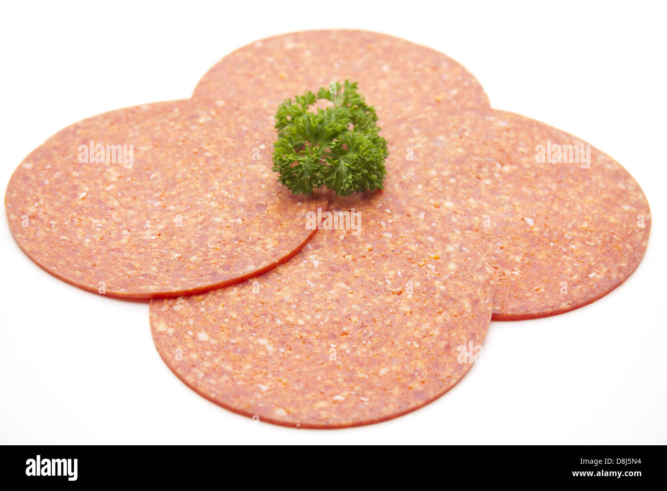 Salami with parsley Stock Photo - Alamy