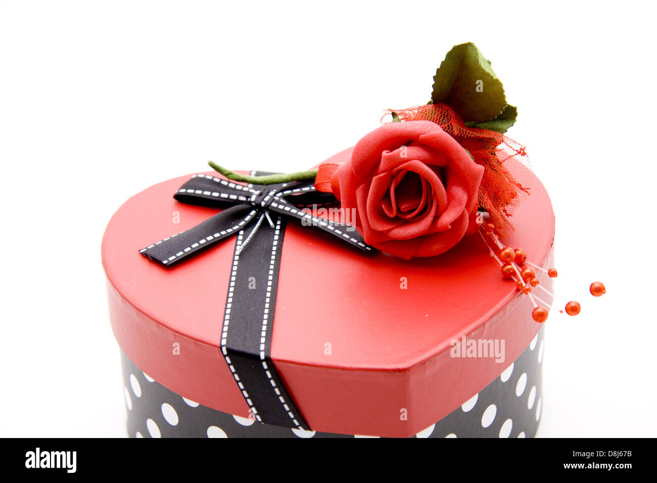 Present heart with rose Stock Photo - Alamy