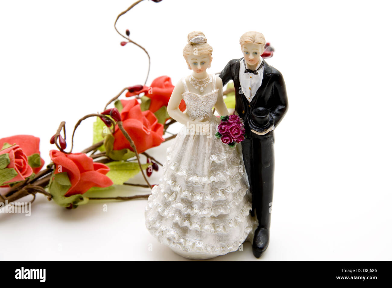 Ceramics bride pair with roses Stock Photo - Alamy