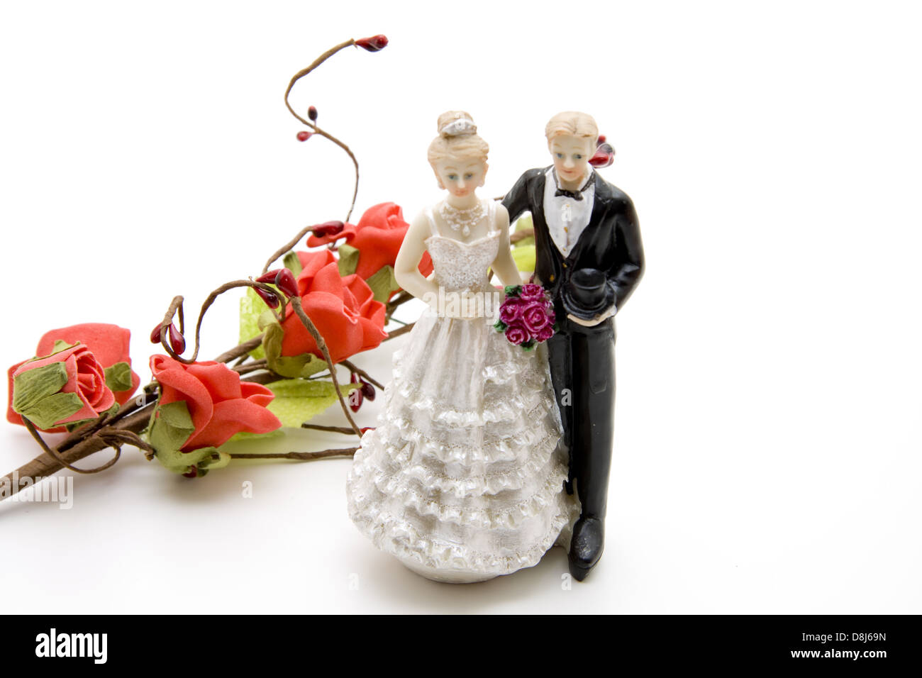 Ceramics bride pair with roses Stock Photo - Alamy