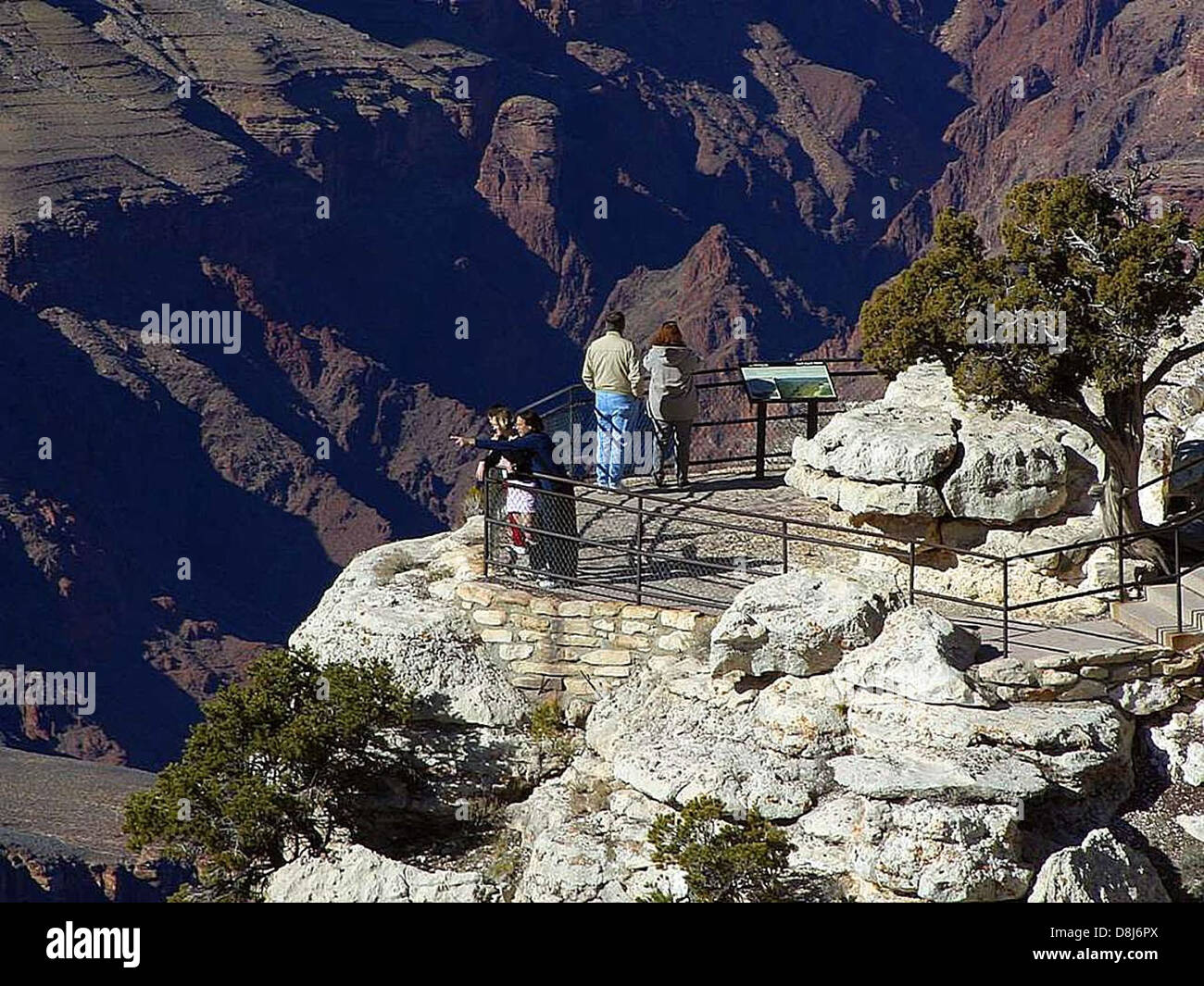 The overlook at the Grand Canyon features railings that direct visitors ...